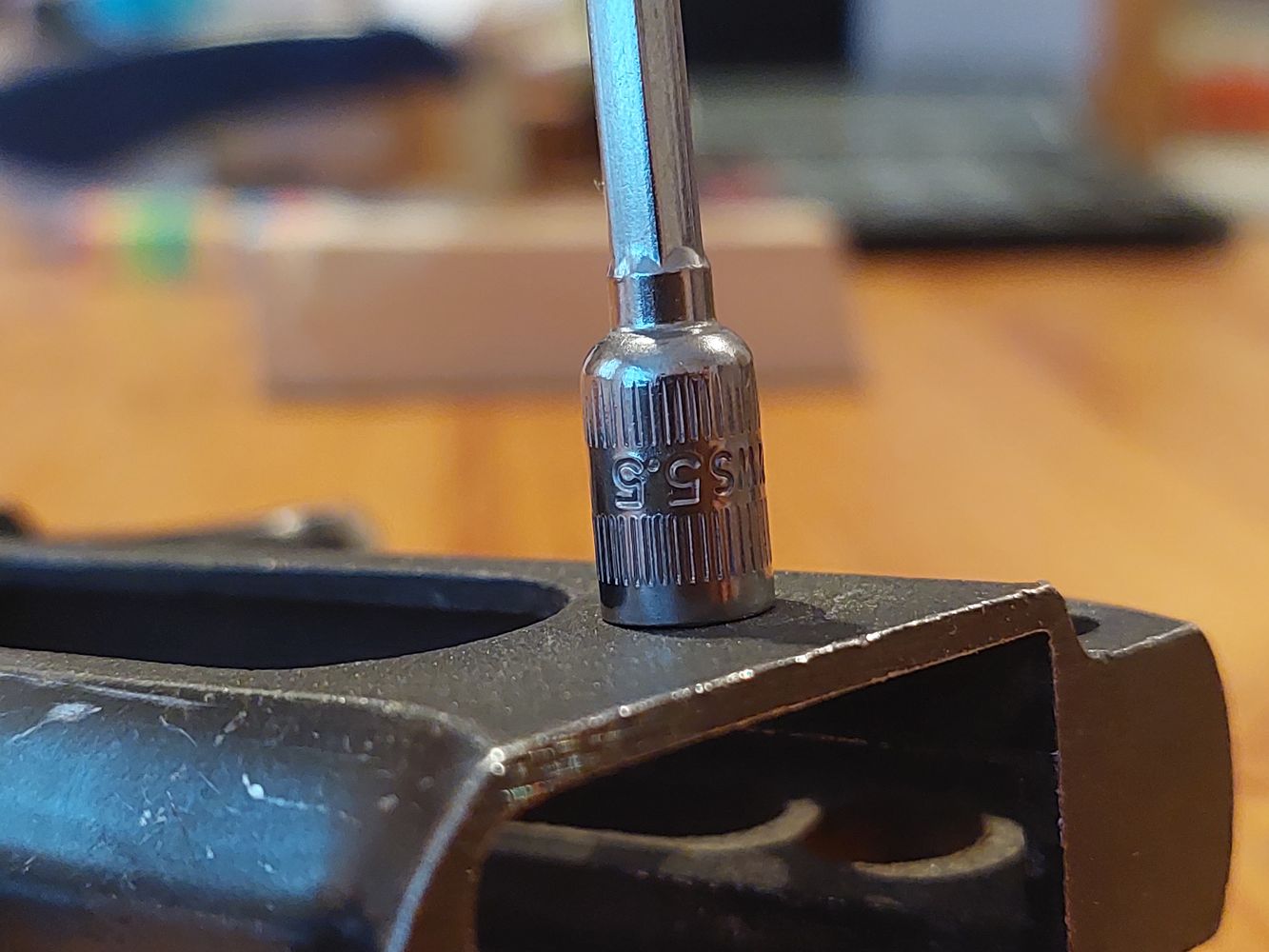 Install the grips using the top screws and the bottom screws.